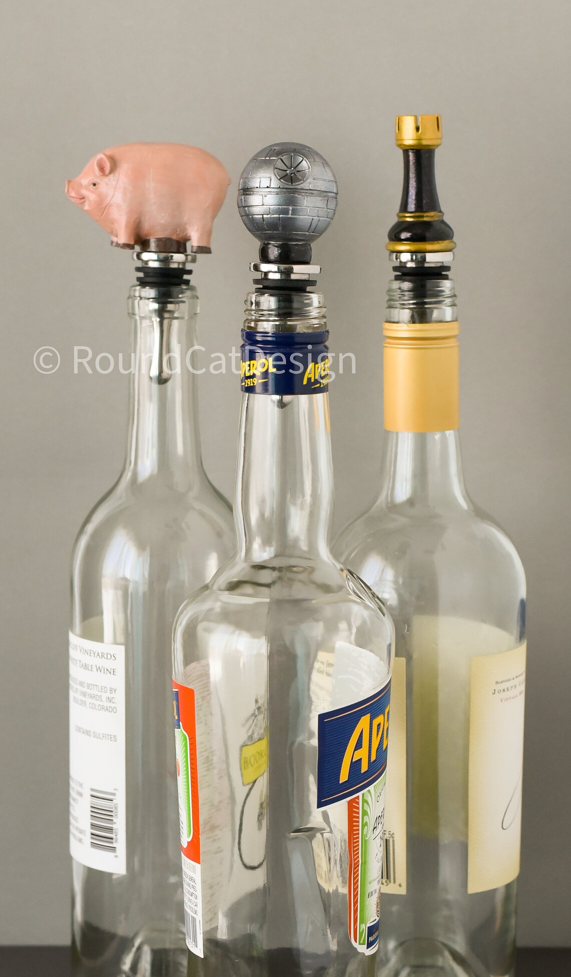 Grogu a.k.a. Baby Yoda in his flying pod bottle stopper. | Etsy