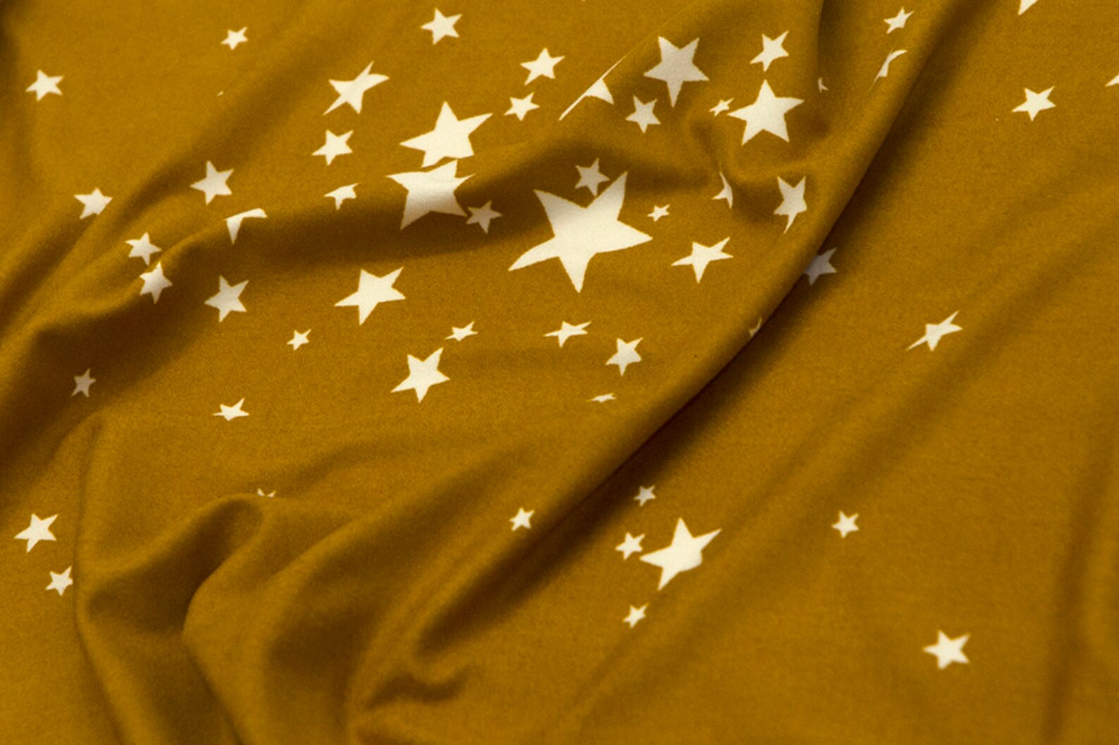 Double Brushed Poly Stars on Mustard Knit Fabric REMNANT, Knit Fabric ...
