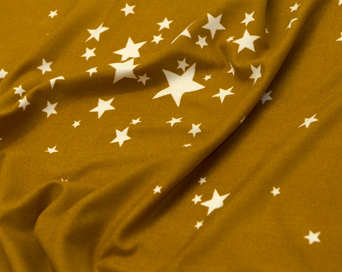 Double Brushed Poly Stars on Mustard Knit Fabric REMNANT, Knit Fabric ...