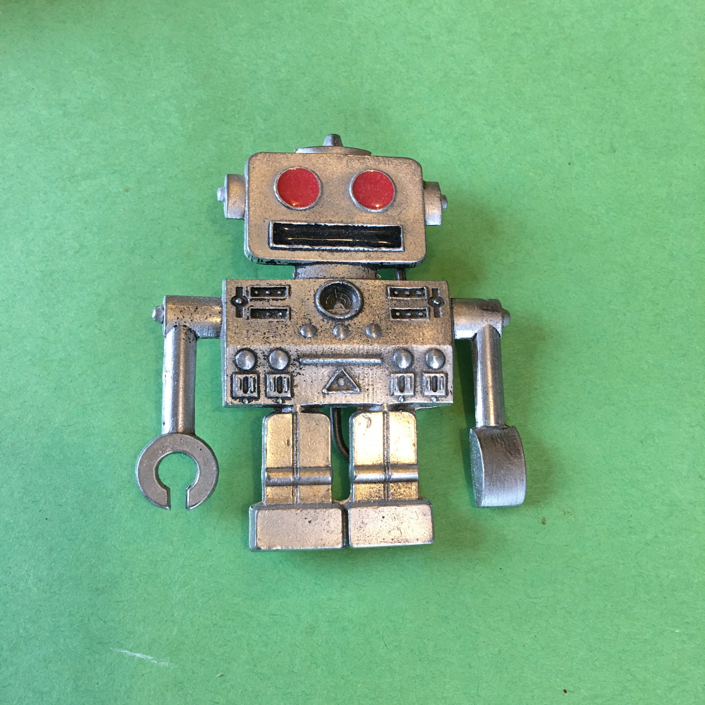 A Toy Robot On A Belt