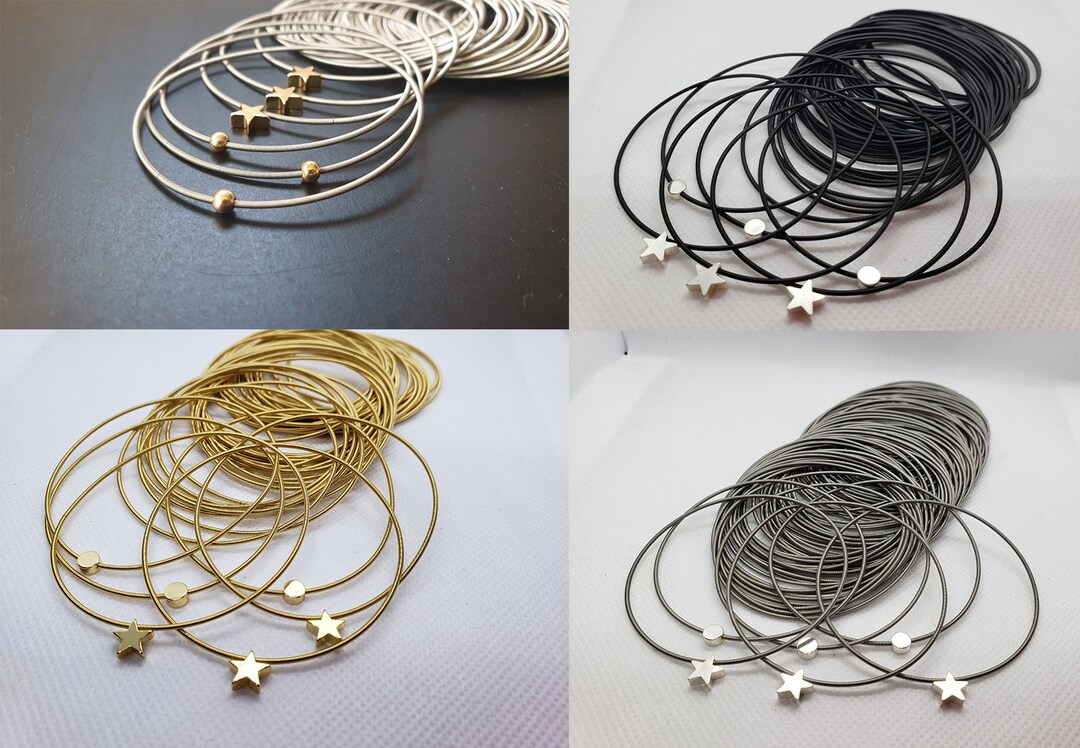 30 pulseras de resorte con seis colgantes de acero inoxidable negro ...