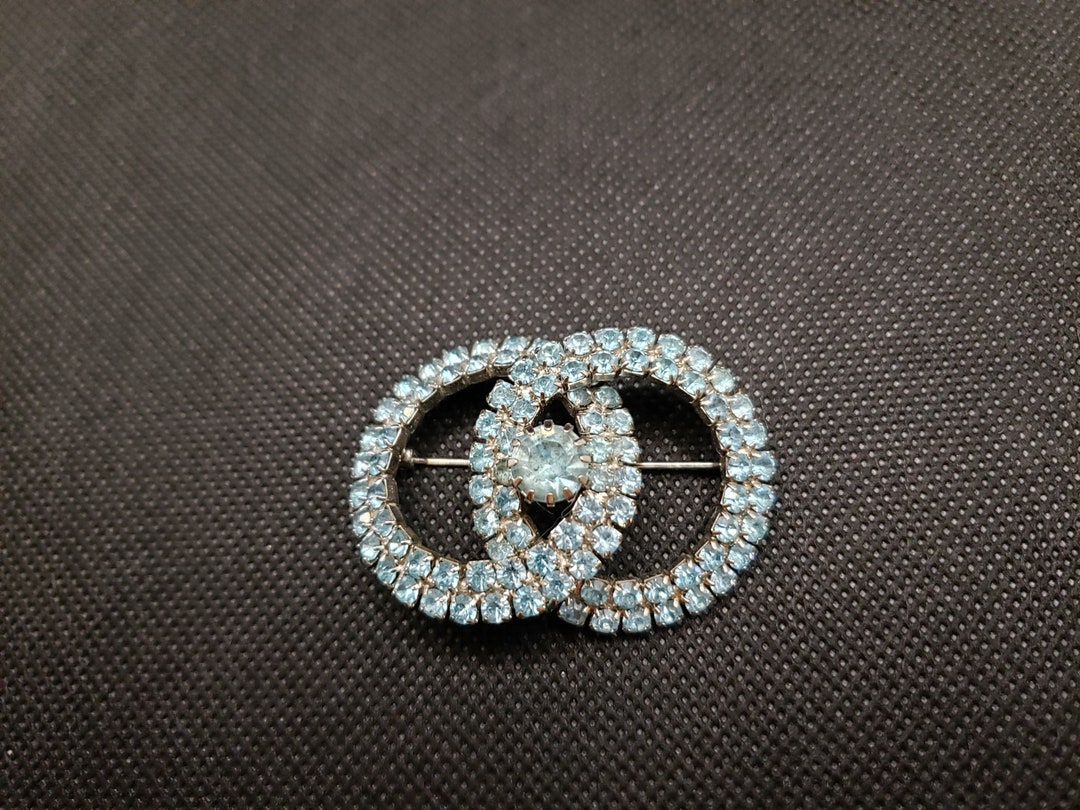Double Circle Brooch Features Silver Metal and Light Blue Faceted Glass ...