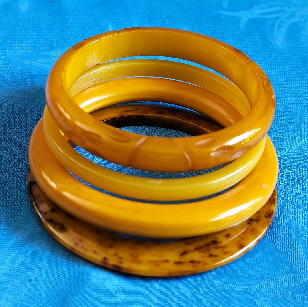 Four Butterscotch/amber Colored Bakelite Bangle Bracelets. One With ...