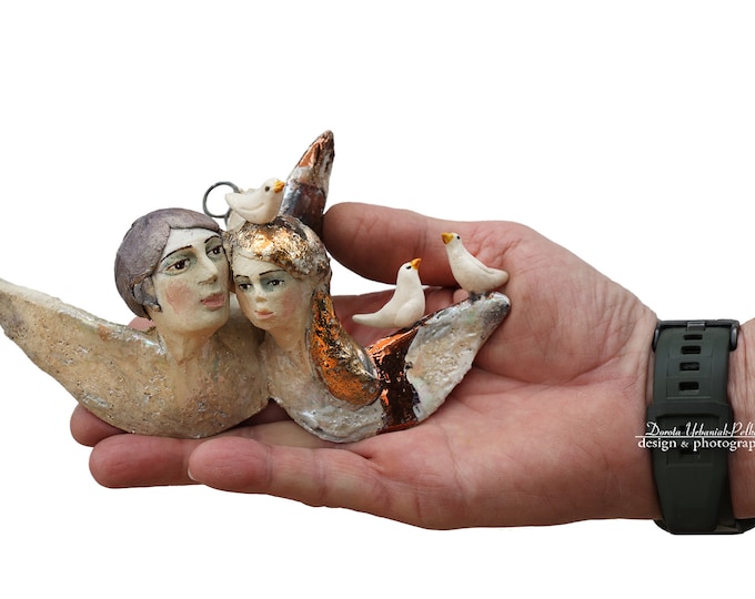 Ceramic Heads of Angels on the Wall With Three Birds Angel Heads to ...