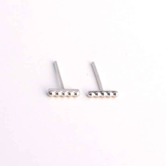 Row of beads stud earrings store