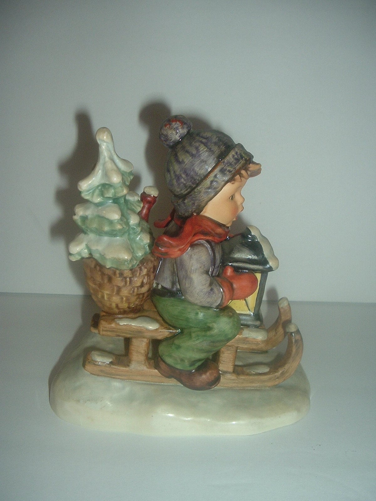 Hummel HUM 396 Ride Into Christmas Boy on Sled with Tree Figurine TMK 5
