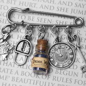 Alice in Wonderland - Giant Pin Brooch - Silver Plate, Drink Me, Charms ...
