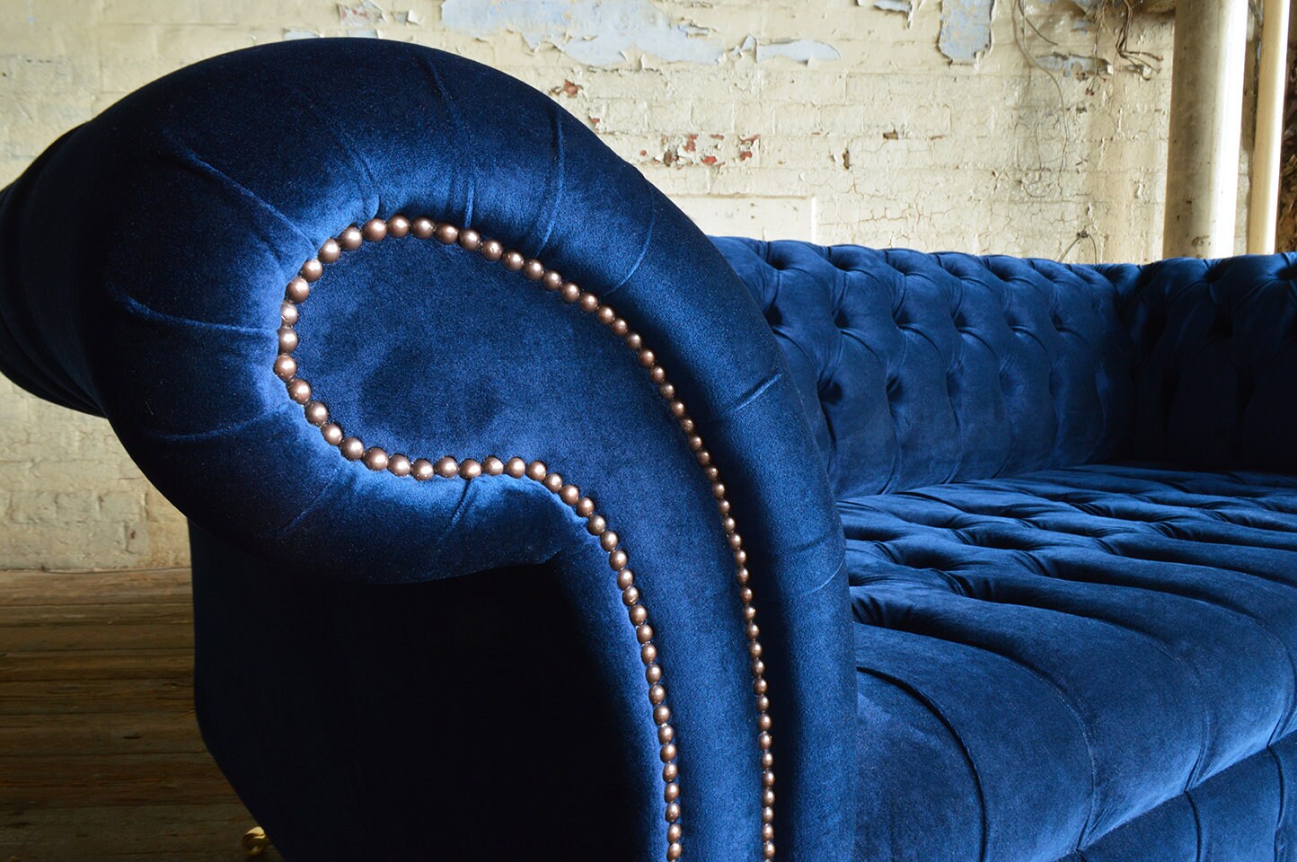Blue studded sofa store