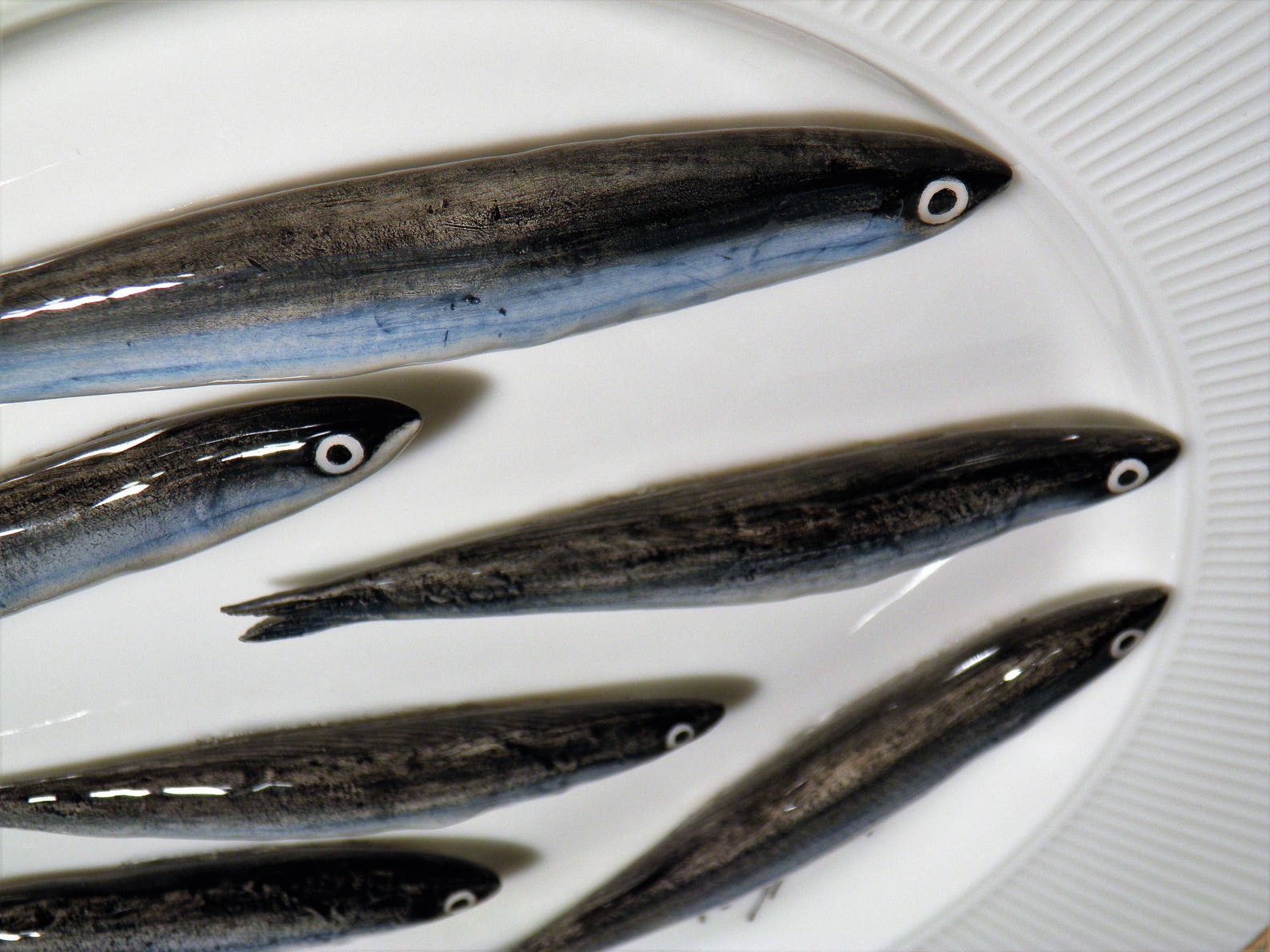 Hand-shaped and Hand-decorated Ceramic Anchovies on a Porcelain Plate ...