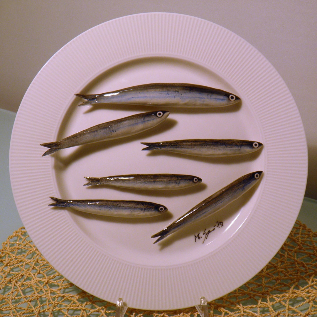 Hand-shaped and Hand-decorated Ceramic Anchovies on a Porcelain Plate ...