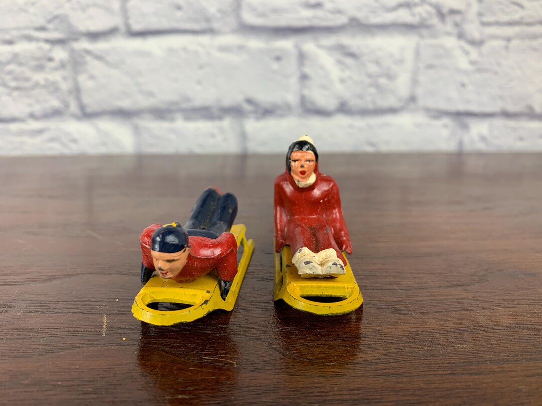 Pair of Barclay Cast Metal Lead Boy and Girl on Yellow Sleds 1940s ...