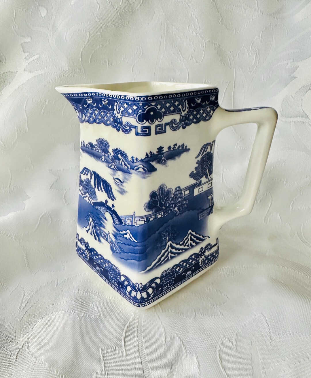 A Limited Edition Blue and White Ringtons 'willow Pattern' Square Jug ...