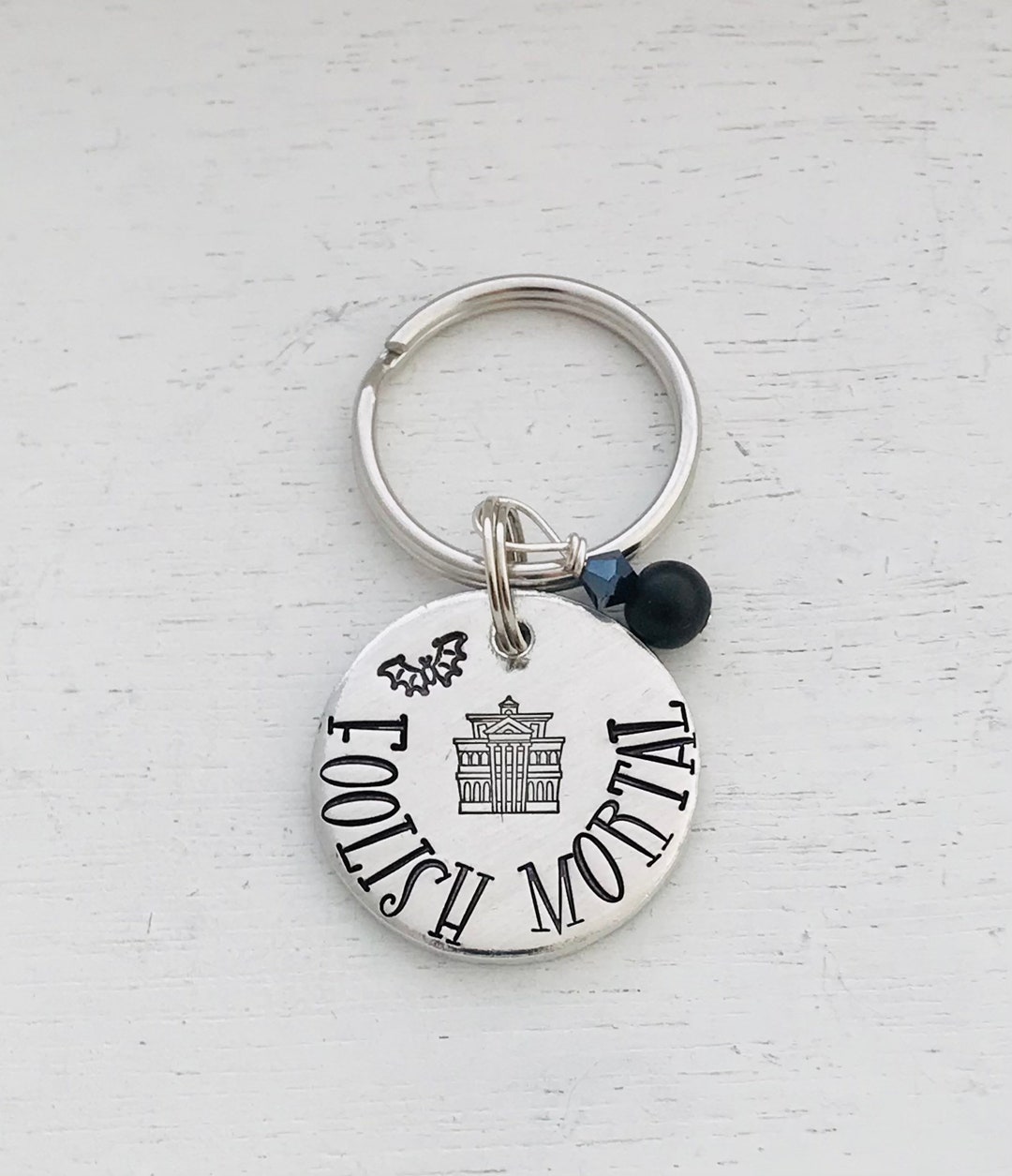 Haunted Mansion Keychain: Foolish Mortal Stamped Charm - Etsy