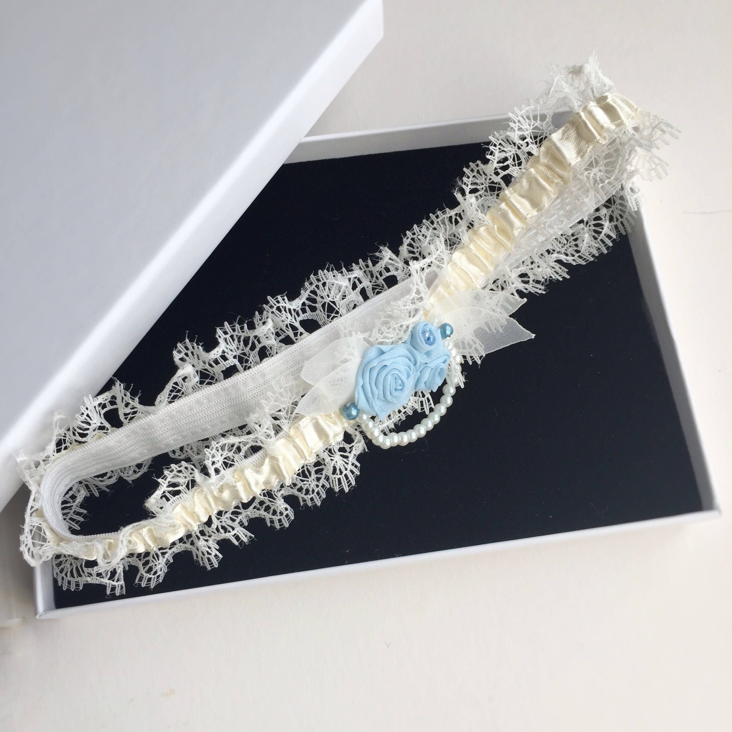 Bridal garter with blue flowers lace wedding garter ivory | Etsy