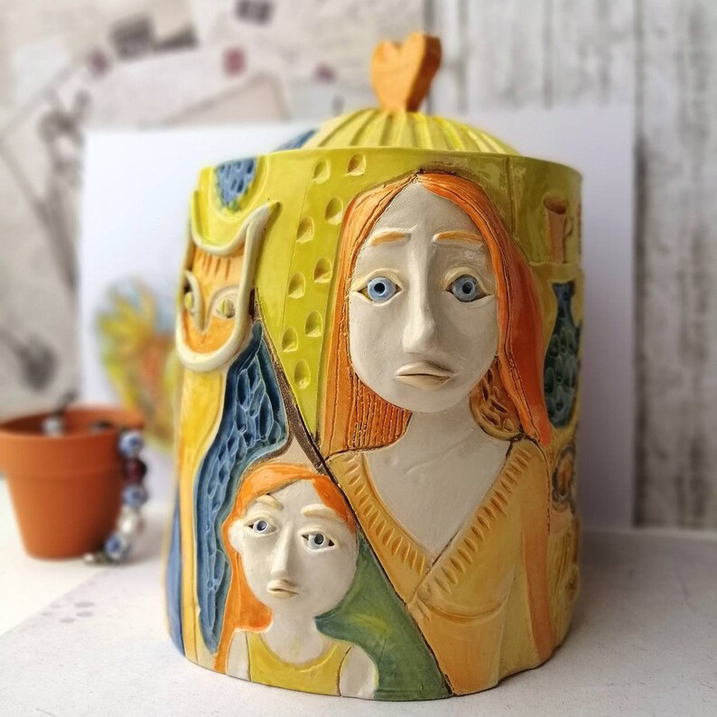 Handmade Pottery Jar With Sculpted Figures Decoration. Mother and ...