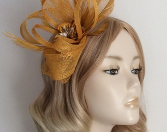 Modern fascinator gold fascinator serpentine shape
