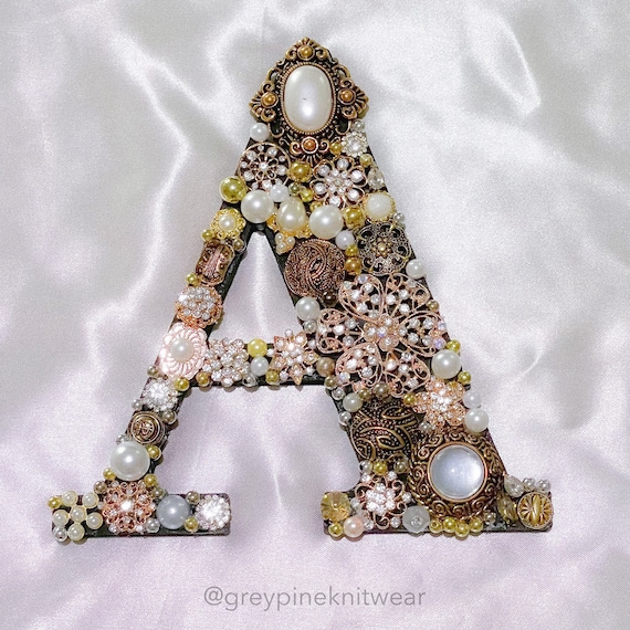 A Jeweled Gold Letters