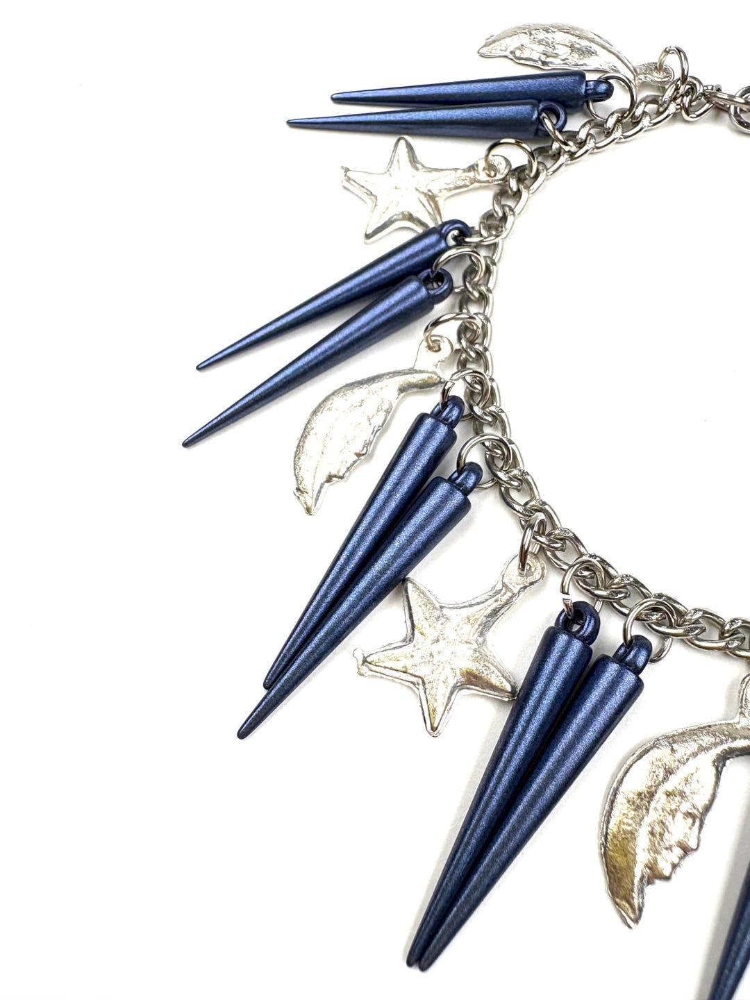 THE SILVER GLOW Crescent Moon and Star Milagros Sit Among Metallic Navy ...