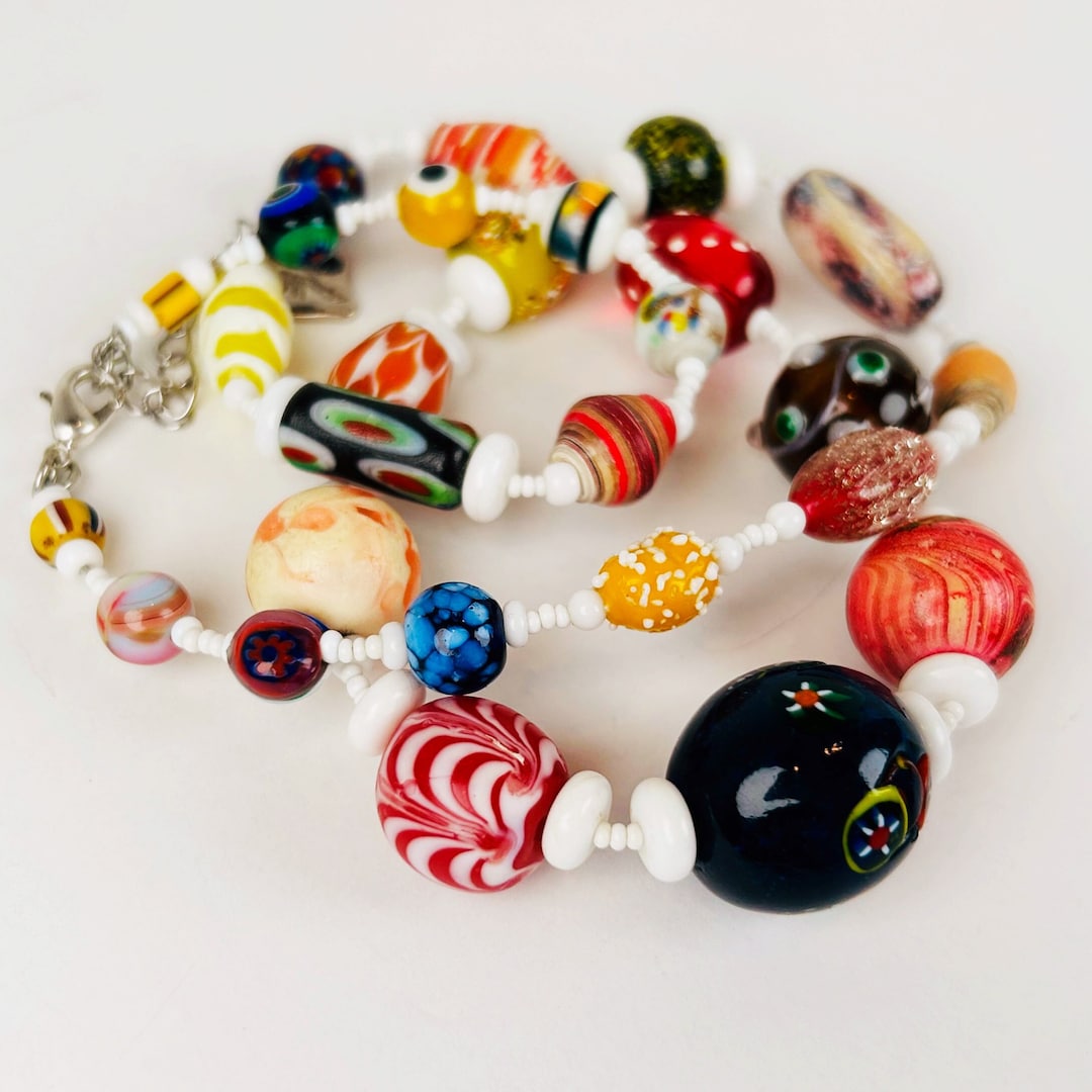THIEVING MAGPIE Crisp White Beads Alternate With A Selection of ...