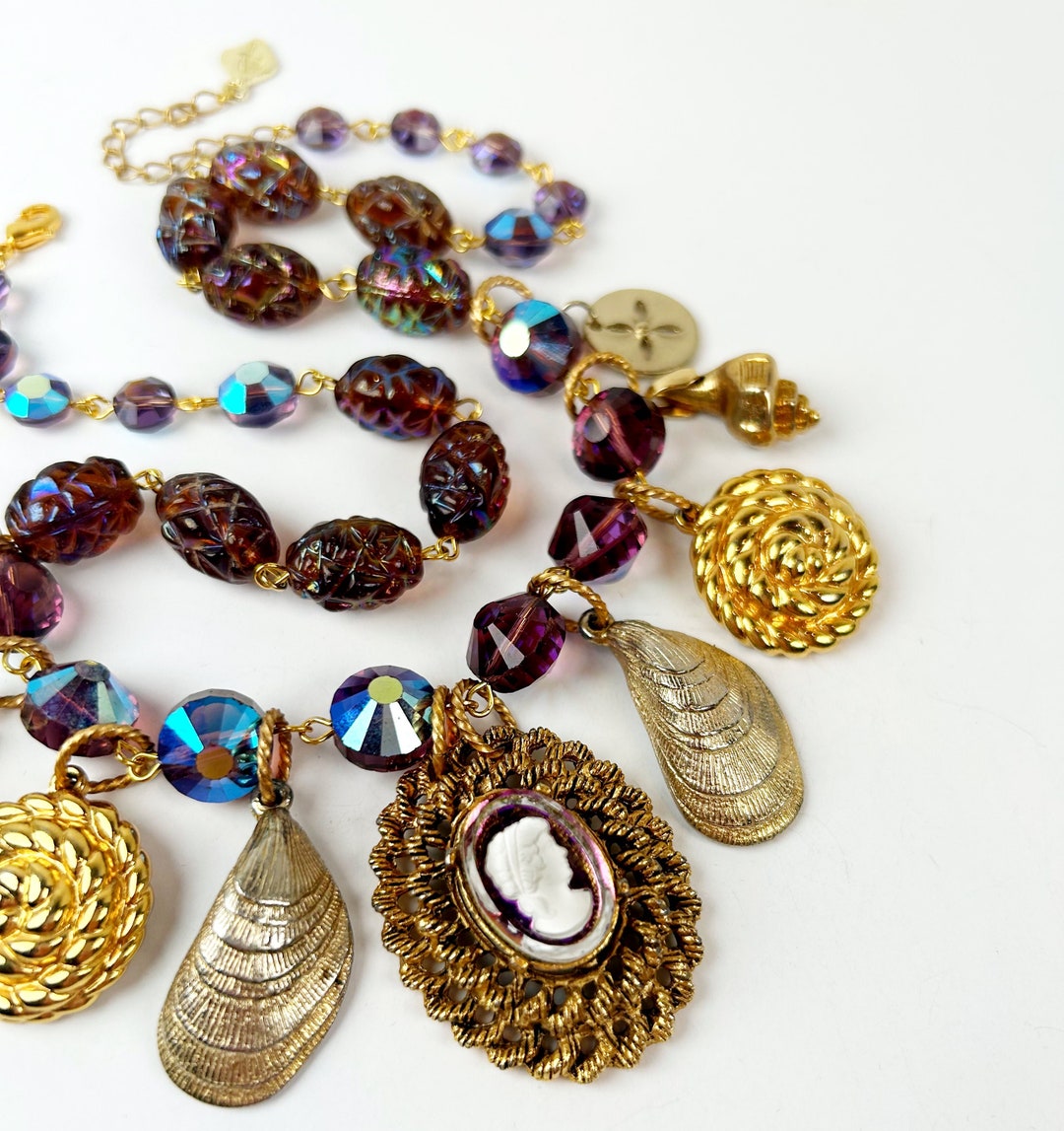 SIREN SONG Darkly Iridescent Beads Hold Golden Cameo, Shells, and ...