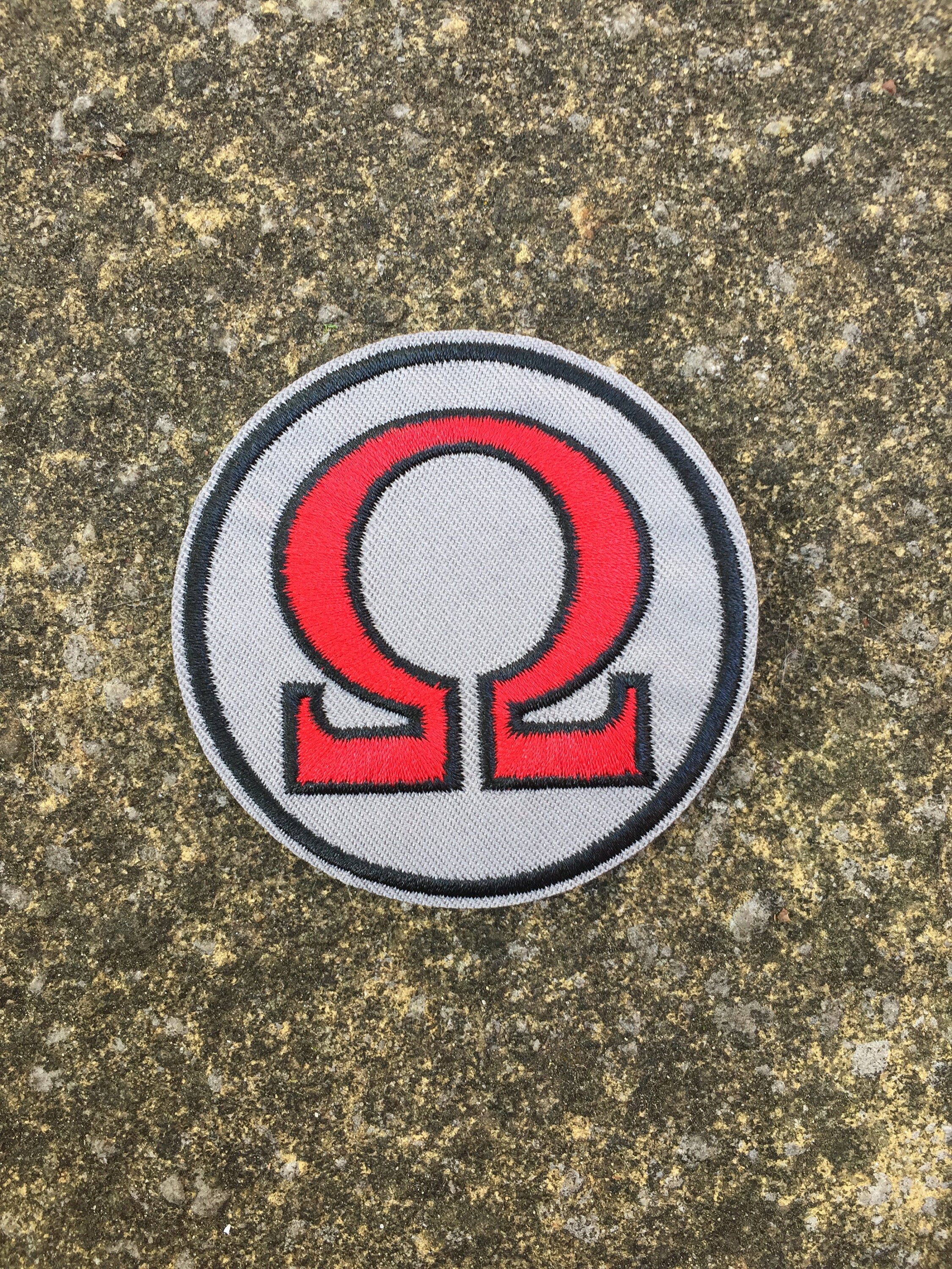 Red Omega Symbol