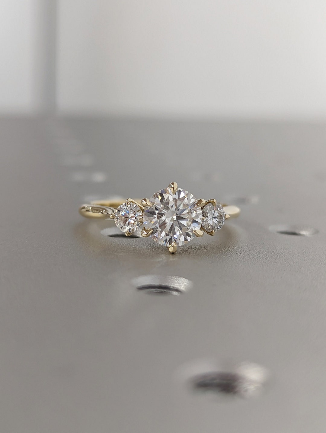 Petite Round Cut Moissanite Three Stone Ring in 14K Yellow Gold ...
