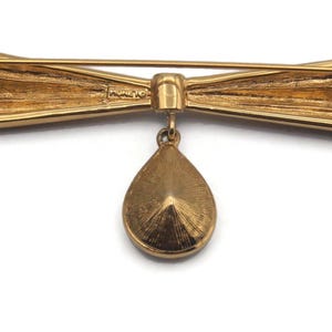 Monet Gold Tone and Clear Rhinestones Bar Brooch With Dangle. Monet ...