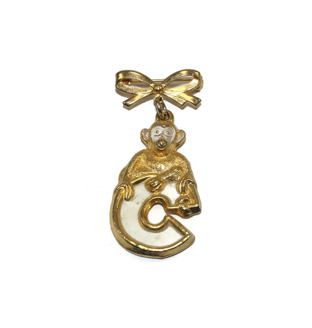 Vintage Signa-Craft tono dorado y blanco esmalte mono, arco y letra C ...