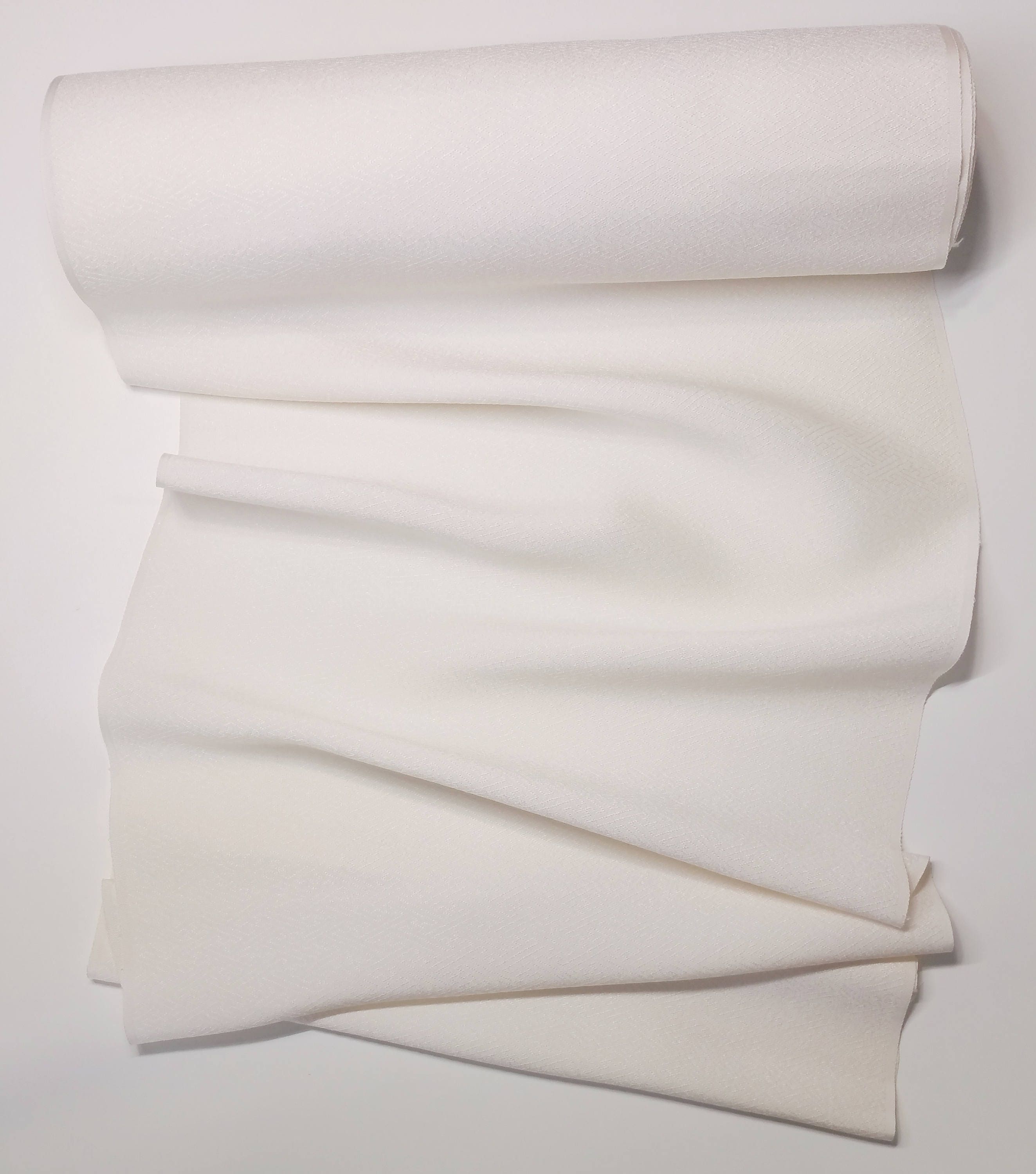 Off-white colored silk rinzu damask kimono fabric with woven sayagata ...