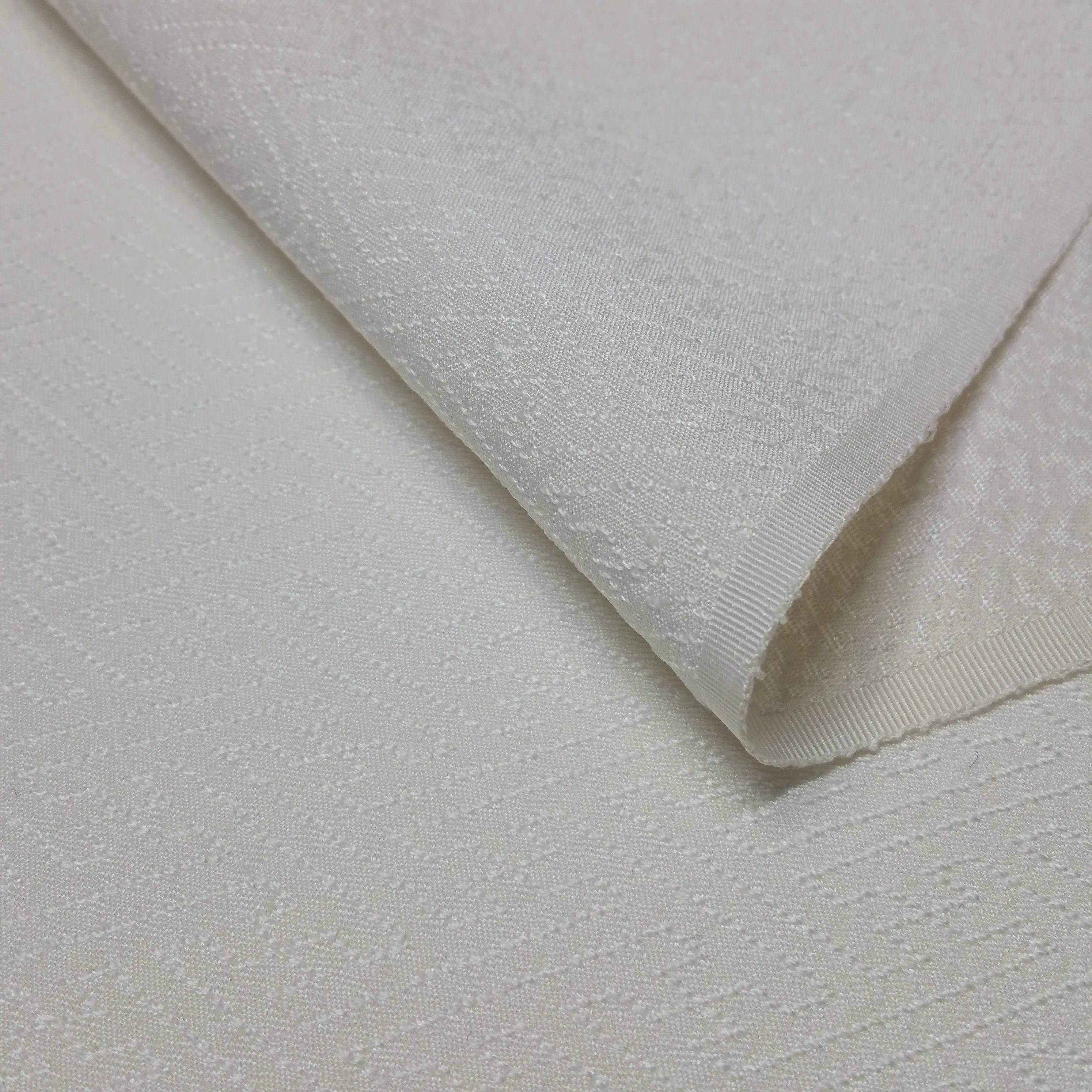 Off-white colored silk rinzu damask kimono fabric with woven sayagata ...