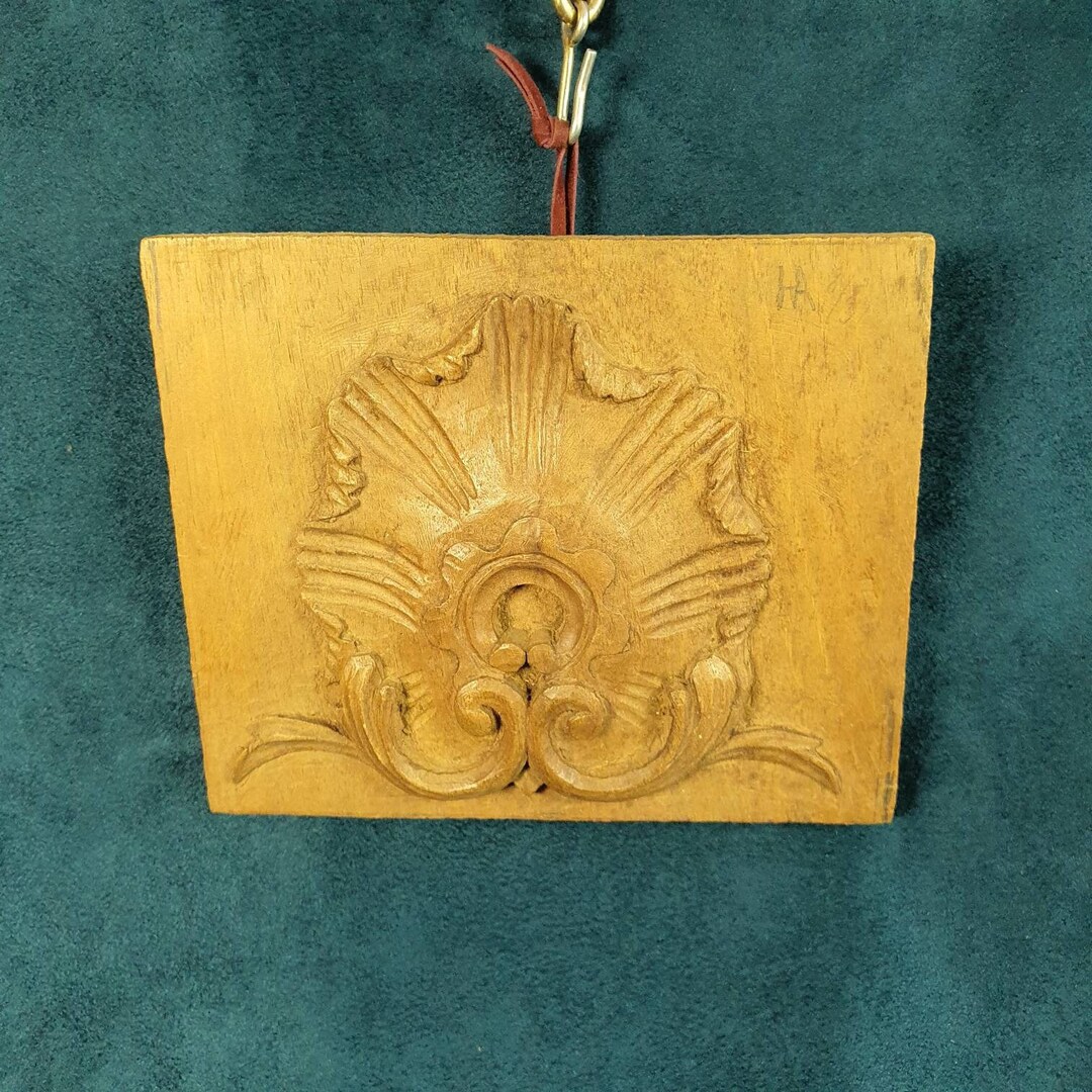 Small Carved Piece of Wood Panel With a Sculpture of a Former Pattern ...