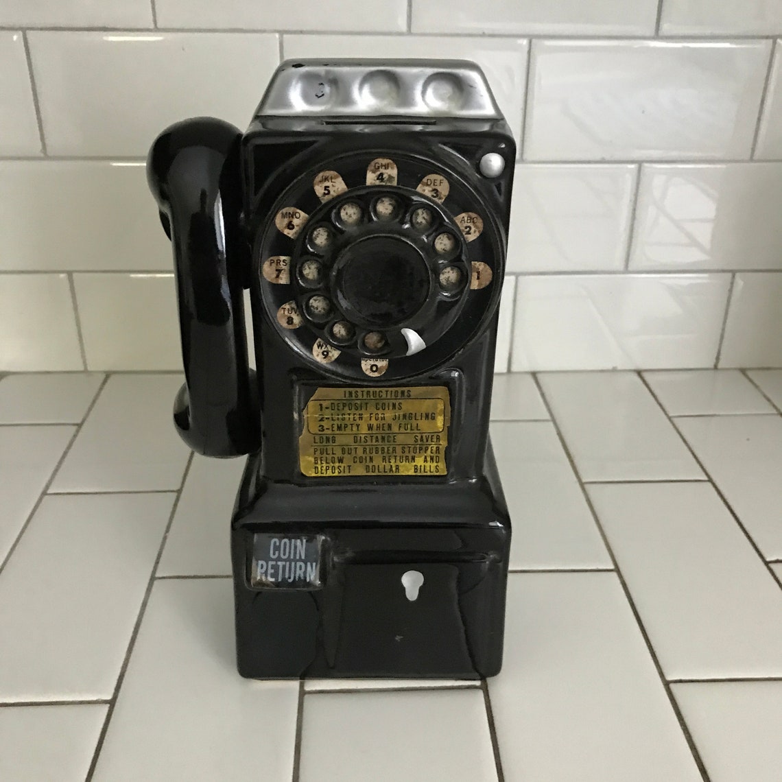 Vintage wall hanging telephone bank with rubber stopper under | Etsy