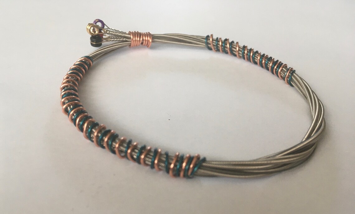 Recycled Electric Guitar String Bracelet styled with sea | Etsy