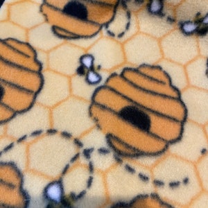 Honey Bee Print Fleece With White Furry Fleece Trim and 3 Inch Pom Pom ...