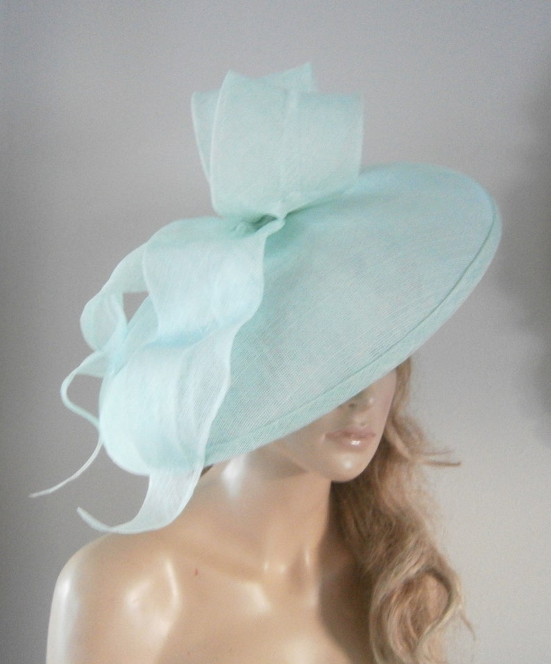 Aqua Saucer With Down Turned Brim Embellished With a Sculptured ...