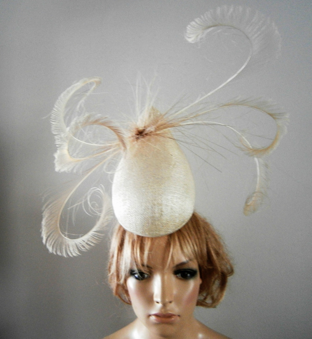 Ivory Percher'3d Pod' Hat Adorned With Dramatic Peacock Swords and ...