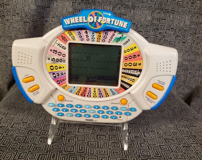 Wheel of Fortune Electronic Handheld Game - Battery Operated - Tiger ...