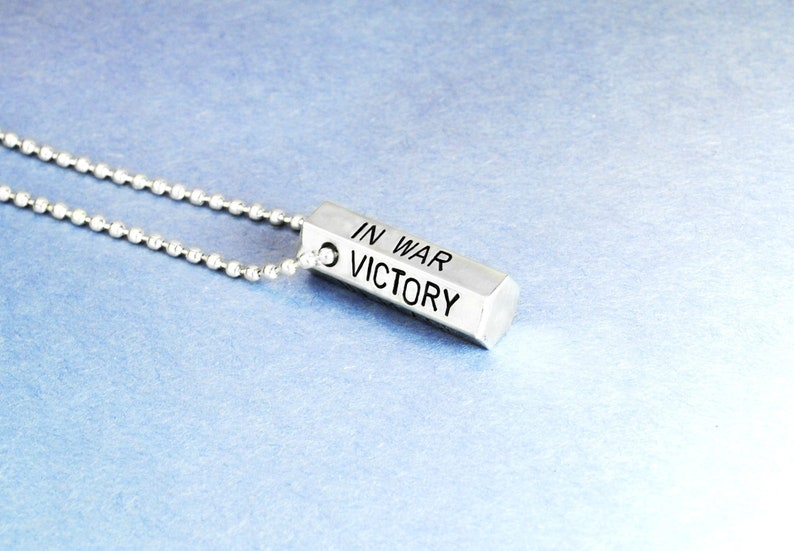 Aluminum Hexagon Necklace: "in War, Victory. in Peace, Vigilance. in ...