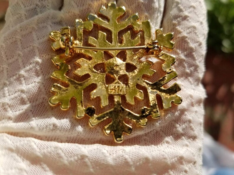 Gold tone metal snowflake brooch with faux silver rhinestones | Etsy