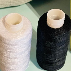 White Thread. Black Thread. Sew All Polyester Thread Spool. White 100% ...