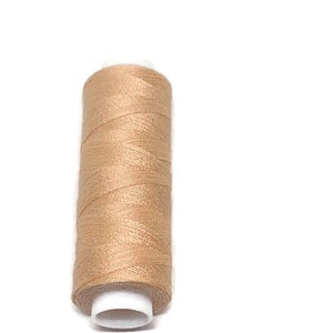 Red Thread. Sew All Polyester Thread Spool. Red 100% Polyester Thread ...