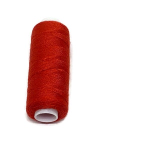 Red Thread. Sew All Polyester Thread Spool. Red 100% Polyester Thread ...
