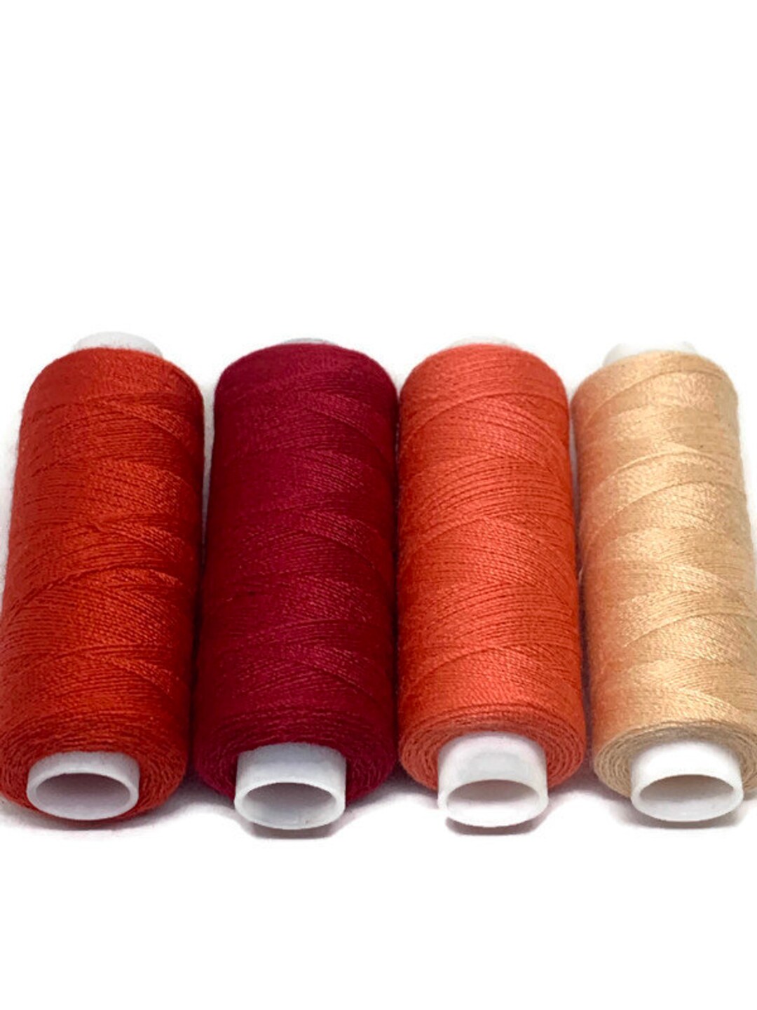Red Thread. Sew All Polyester Thread Spool. Red 100% Polyester Thread ...