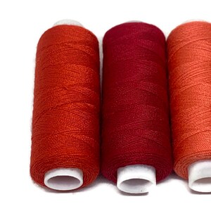 Red Thread. Sew All Polyester Thread Spool. Red 100% Polyester Thread ...