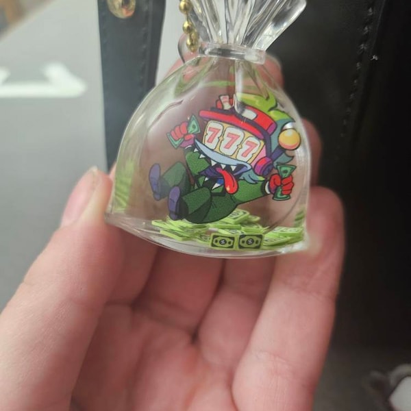 Duck Shuffler Liquid Money Bag Charm - Toontown Corporate Clash ...