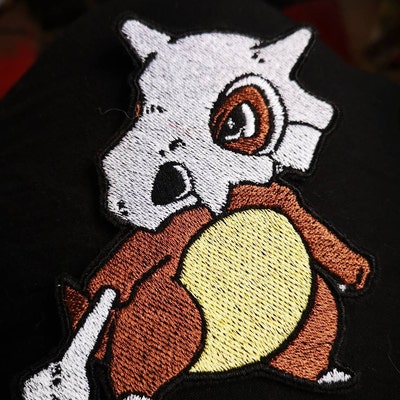 Cubone Iron on Patch Shiny Metallic Embroidered. Pokemon - Etsy