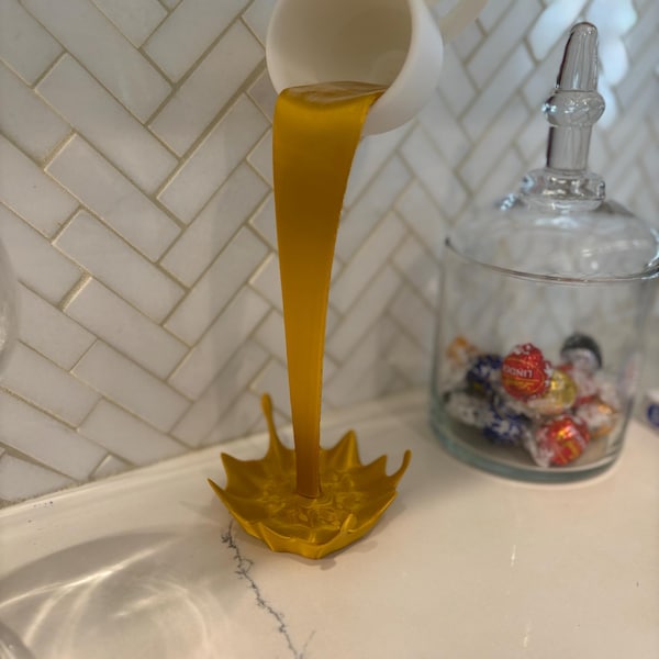 Gravity-defying Liquid Sculpture, Frozen in Time, a Cup Pouring Liquid ...