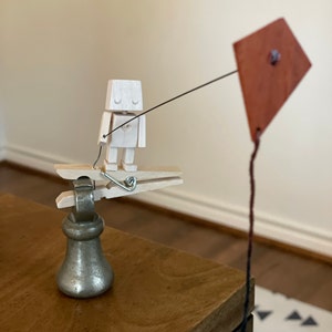 Tiny Robot Clothespin Automaton Flying a Kite it Pulls on the Kite ...