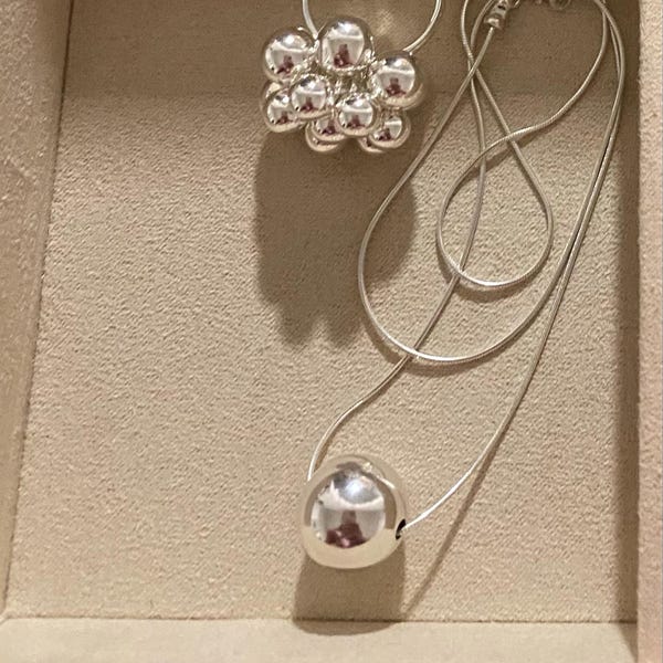 Dangling Balls Sterling Silver Ring A Playful yet Elegant Statement ...