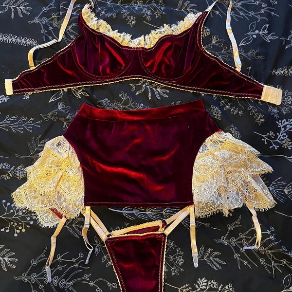 Bold and Captivating, This Glossy Red Trench Coat is the Epitome of Fierce Elegance. Crafted ...